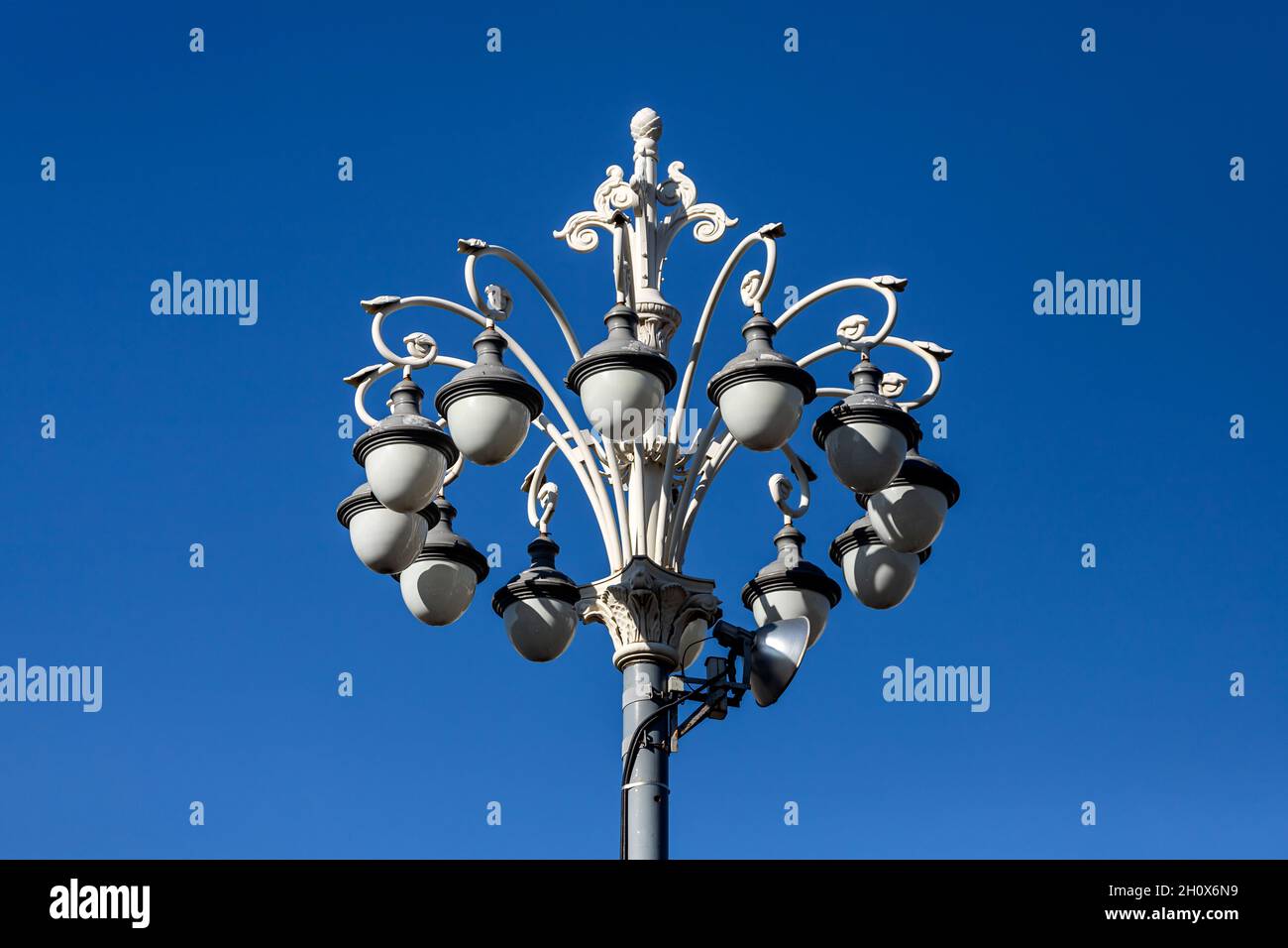 Beautiful vintage lamp post with swirls and curls against sky ...