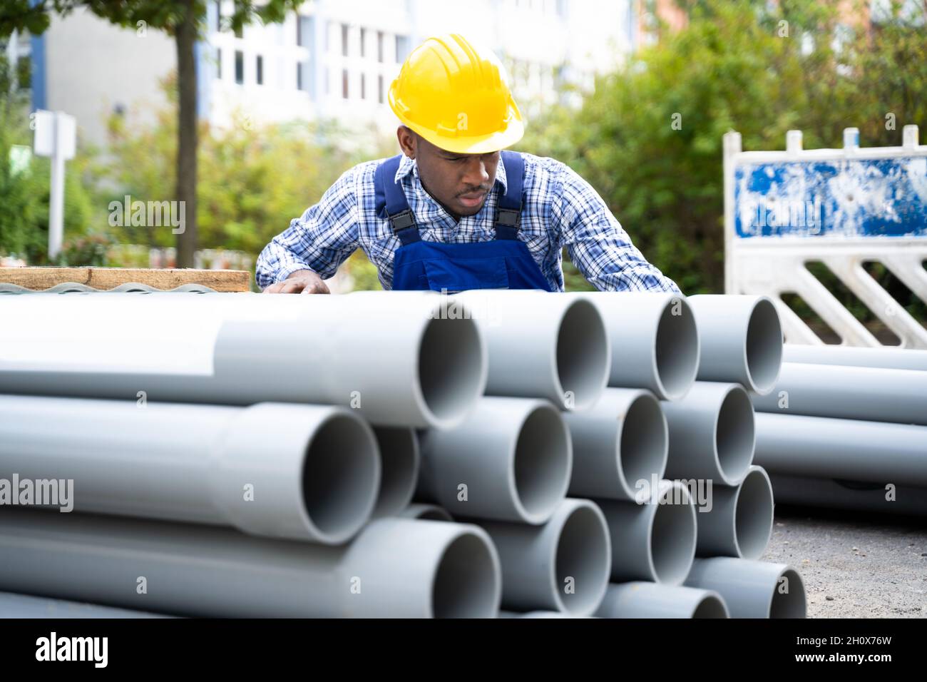Construction Worker Builder Working At Site. Pipes And Sewage Stock ...