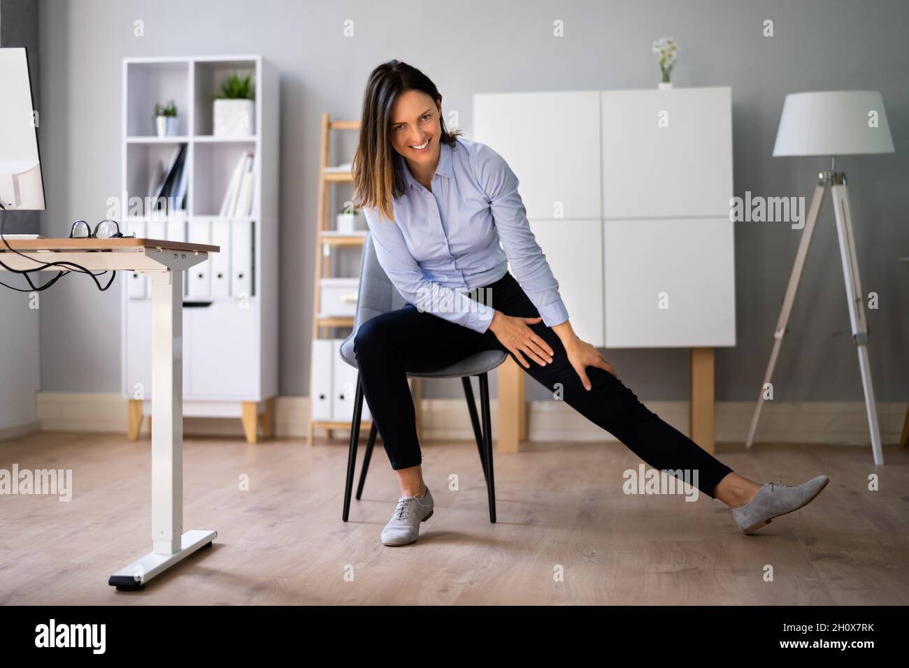 Stretch Exercise Workout Near Office Desk. Worker Stretching Stock ...