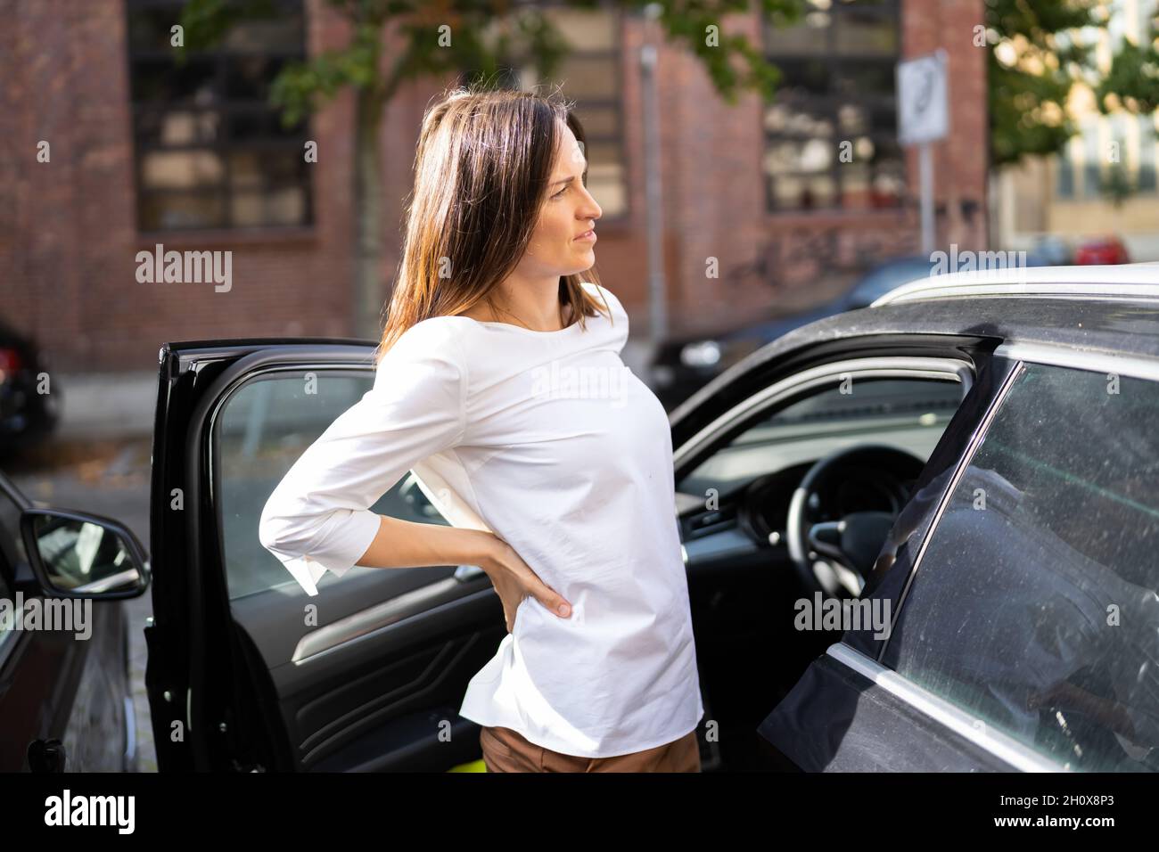 Bad posture driving position young hi-res stock photography and images ...