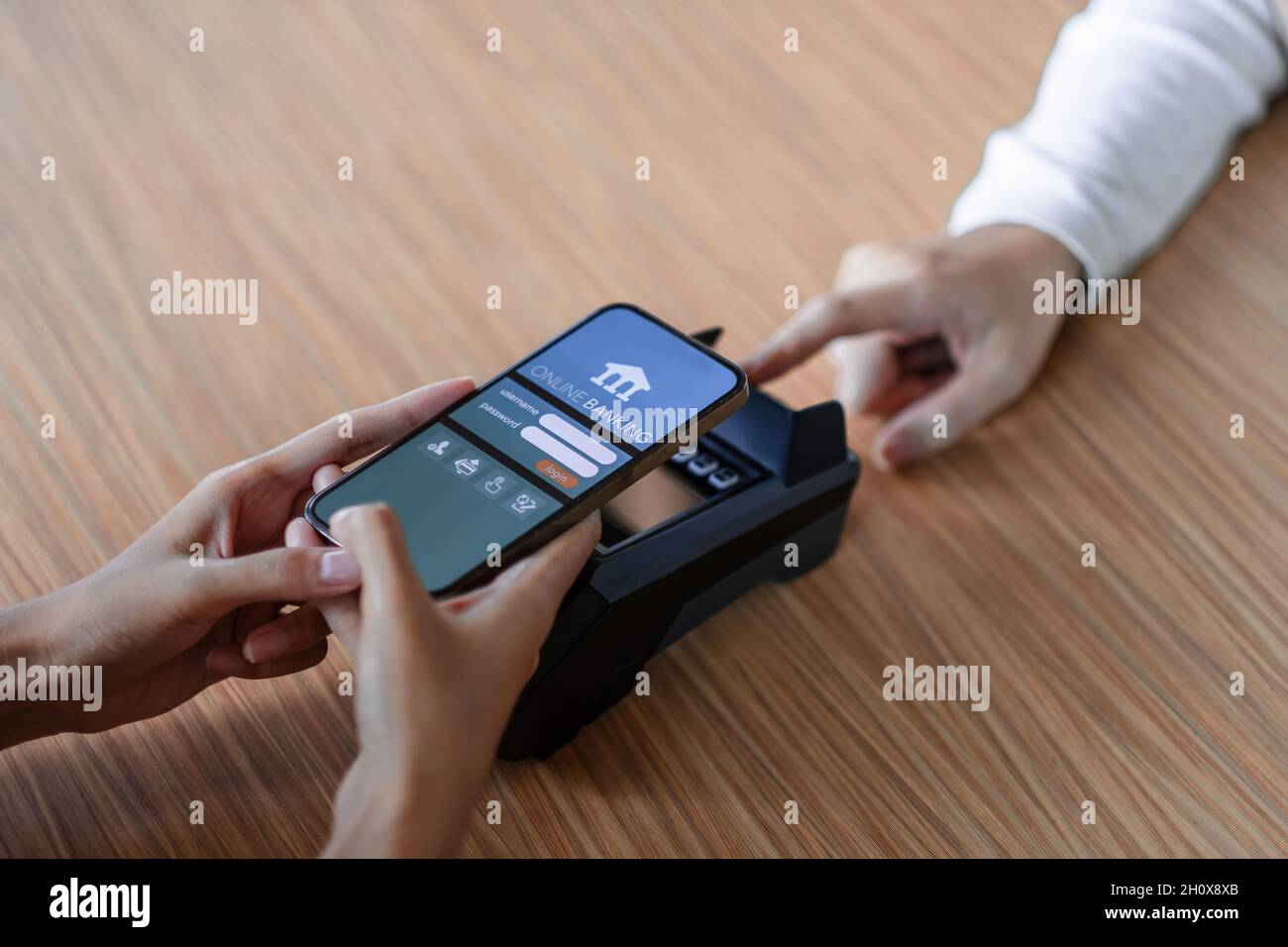 Close up customer make mobile payment contactless paying with NFC technology on smart phone ...