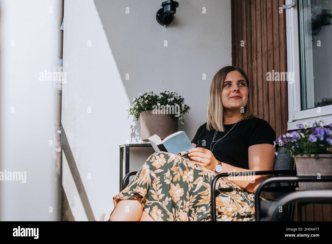 Women relaxing on balcony hi-res stock photography and images - Alamy