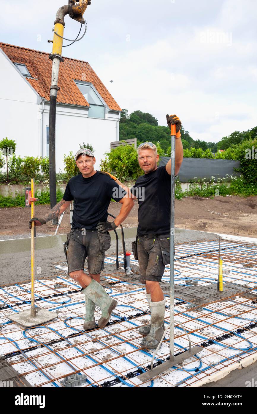 Workers preparing foundations Stock Photo - Alamy