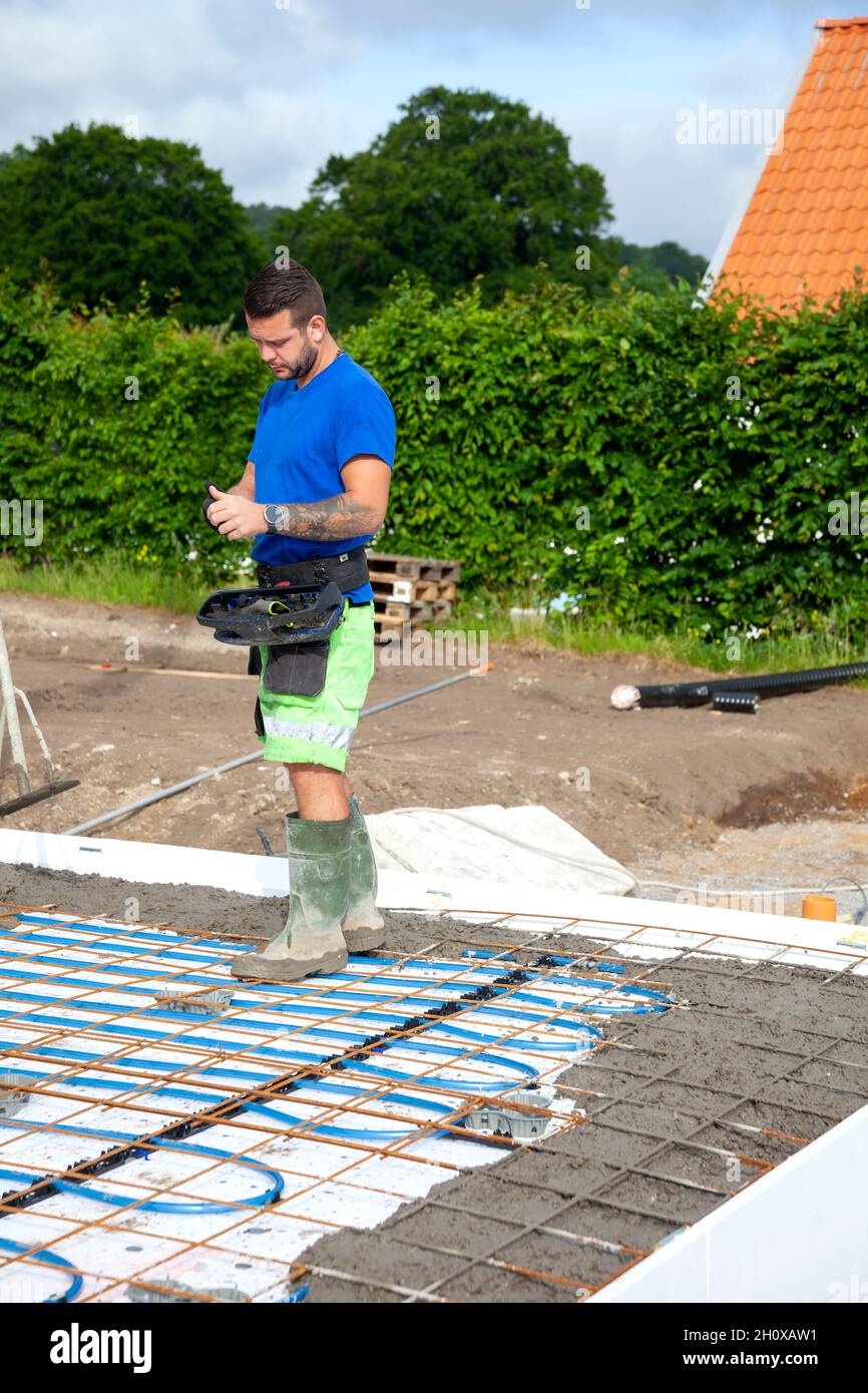 Worker preparing foundations Stock Photo - Alamy