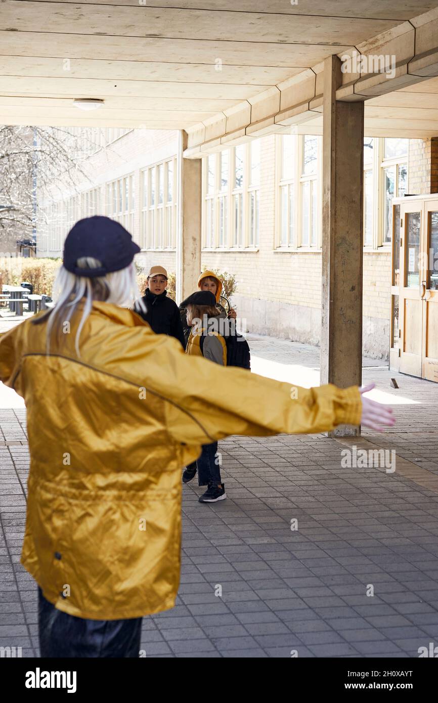 Children in front of school building Stock Photo - Alamy