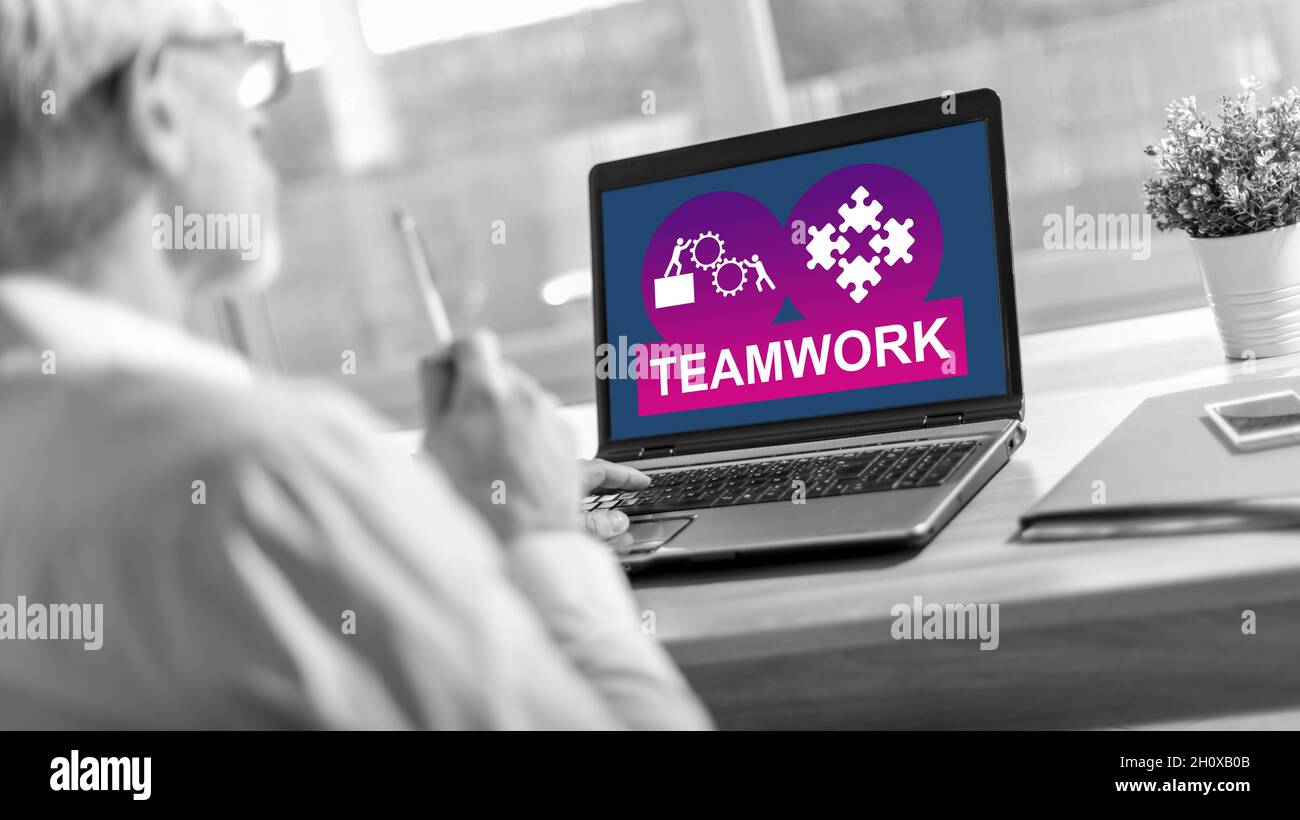 Laptop screen displaying a teamwork concept Stock Photo - Alamy