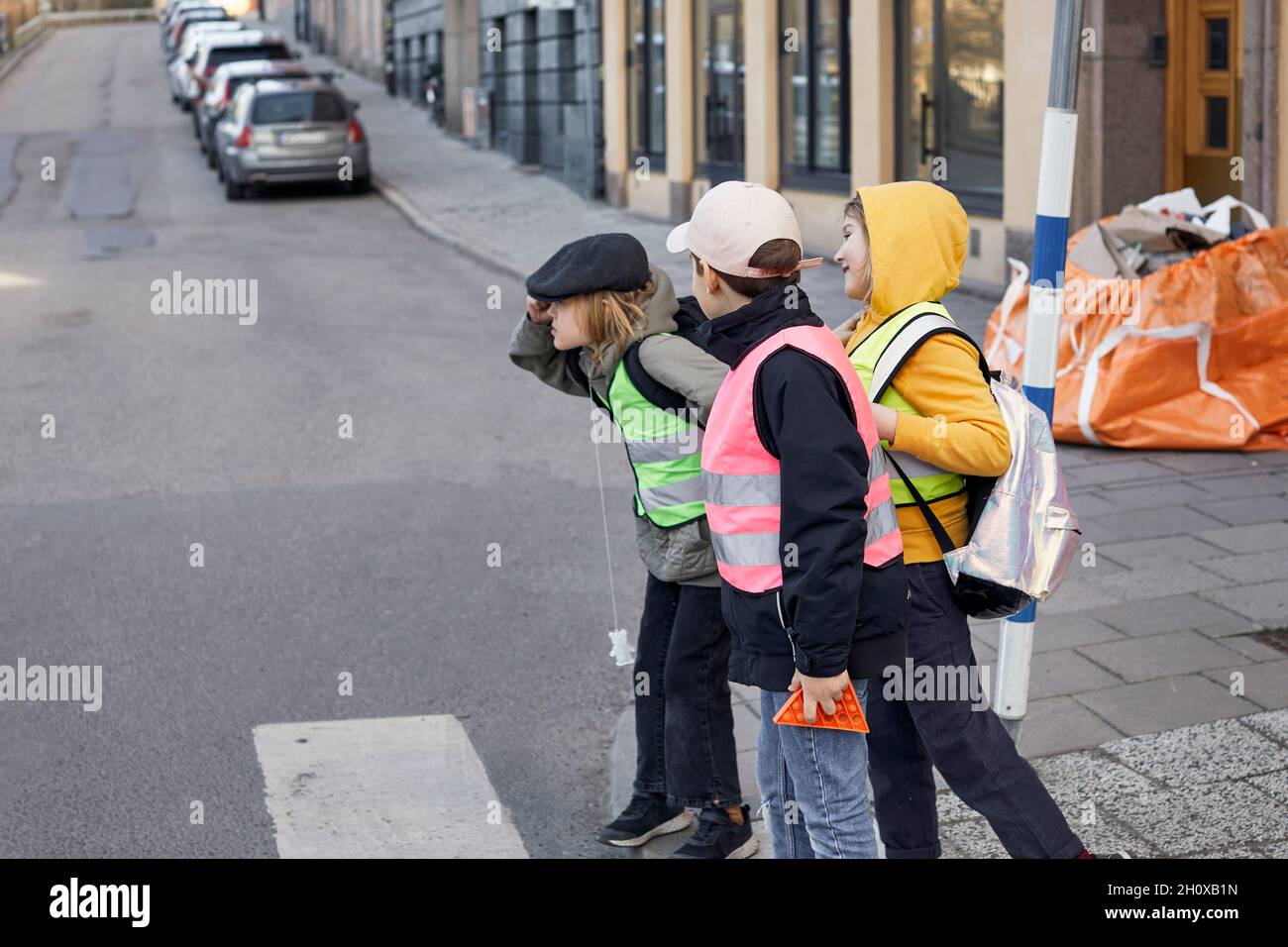 Children crossing road together Stock Photo - Alamy