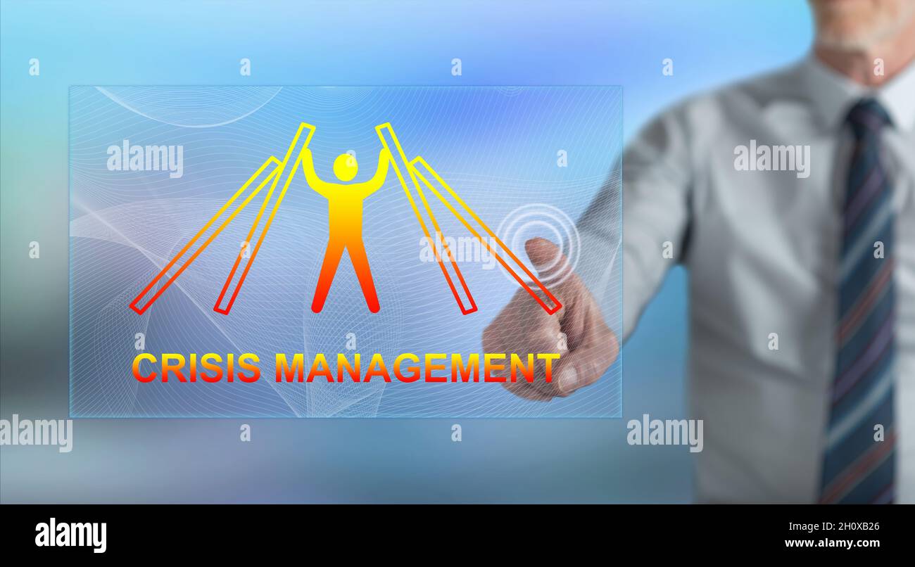 Man touching a crisis management concept on a touch screen with his ...
