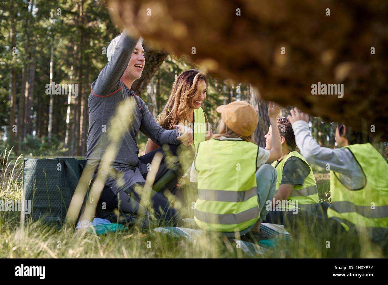 Teachers with school children sitting outside Stock Photo - Alamy