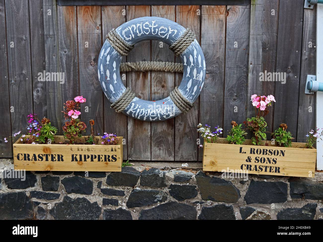 Lifebelt and fish boxes decorate entrance to The Kipper Shop, Craster ...