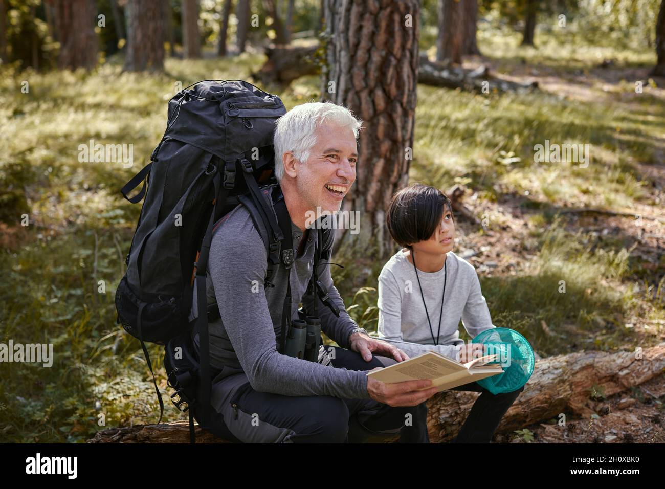 Father with son in forest Stock Photo - Alamy