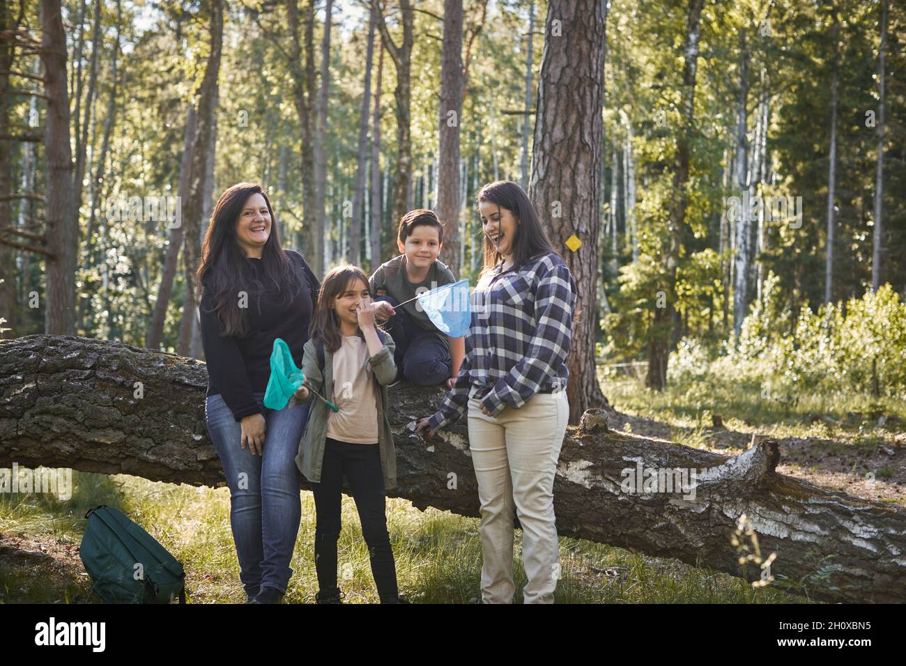 Family with children in forest Stock Photo - Alamy
