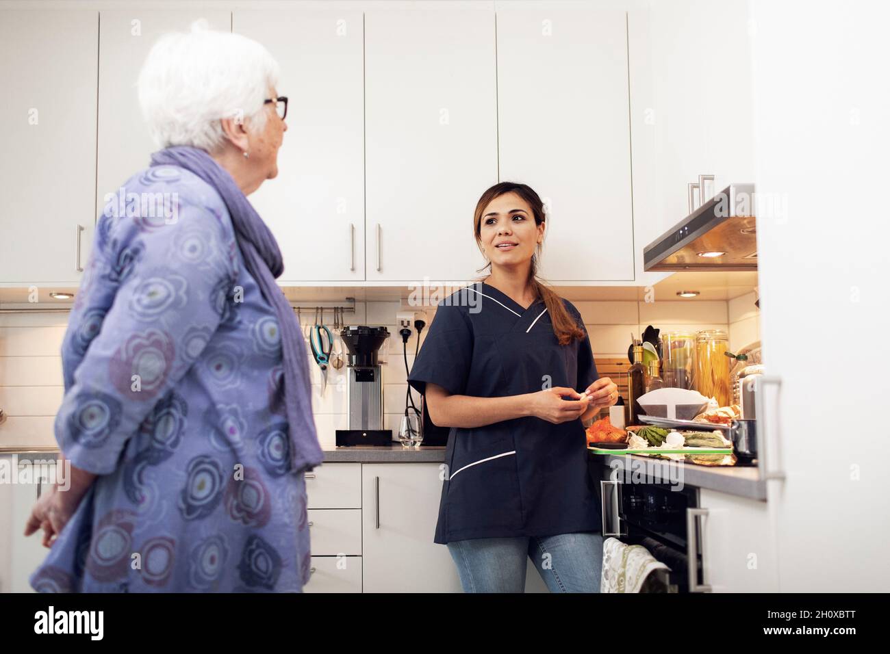 Helping elderly woman hi-res stock photography and images - Alamy