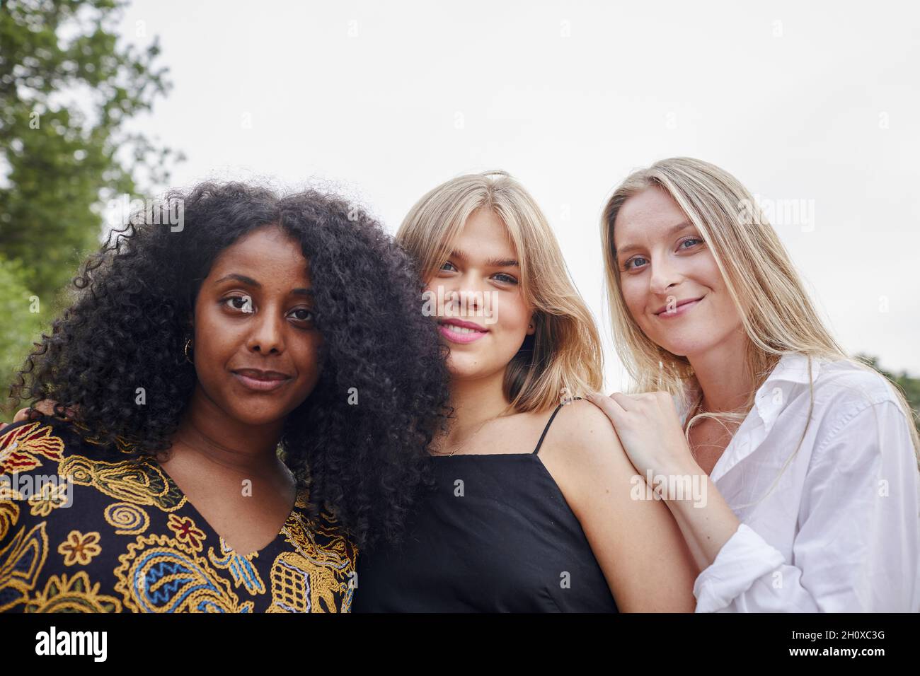 Portrait of three young women Stock Photo - Alamy