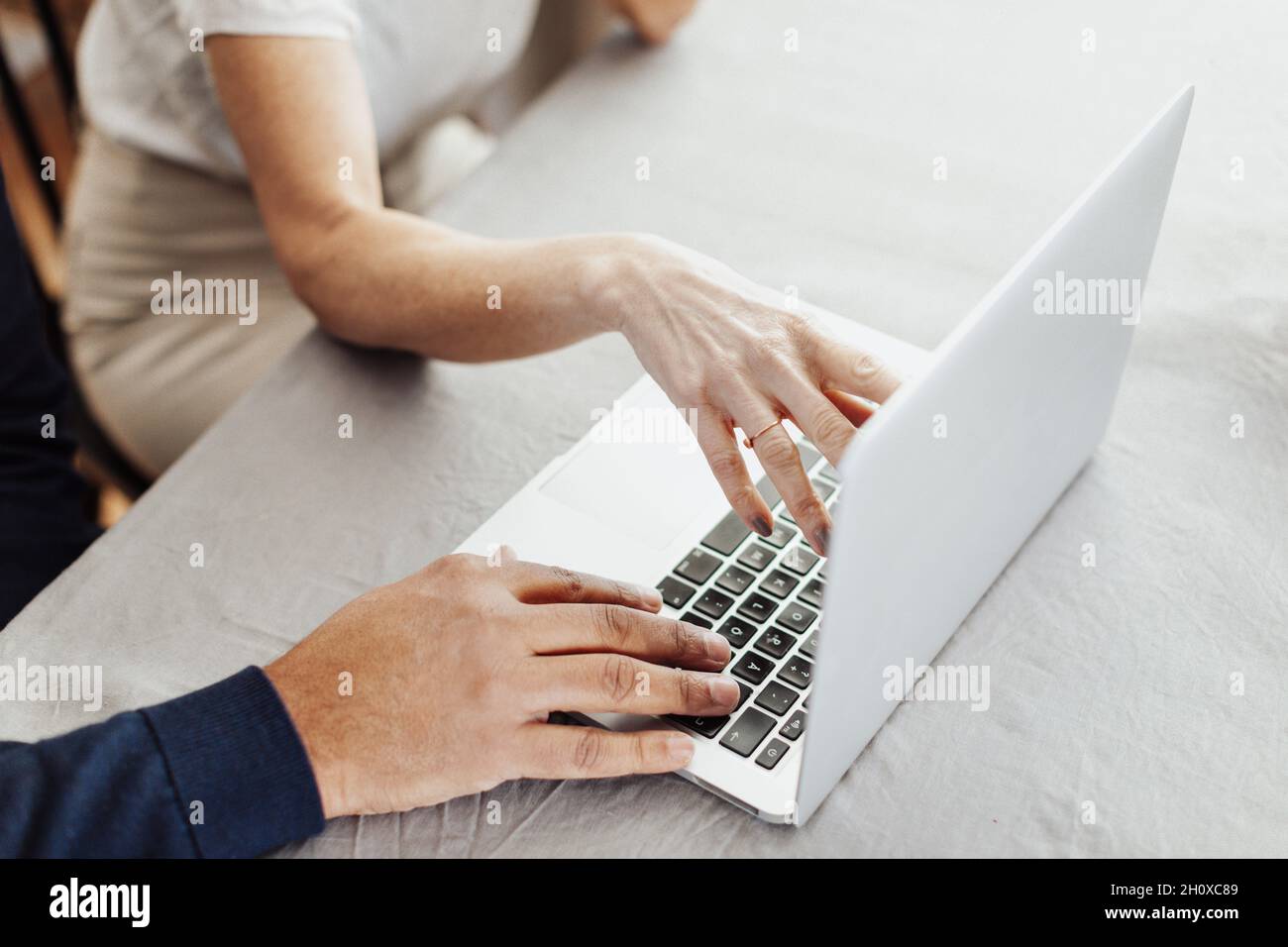 Hands on laptop keyboard Stock Photo - Alamy