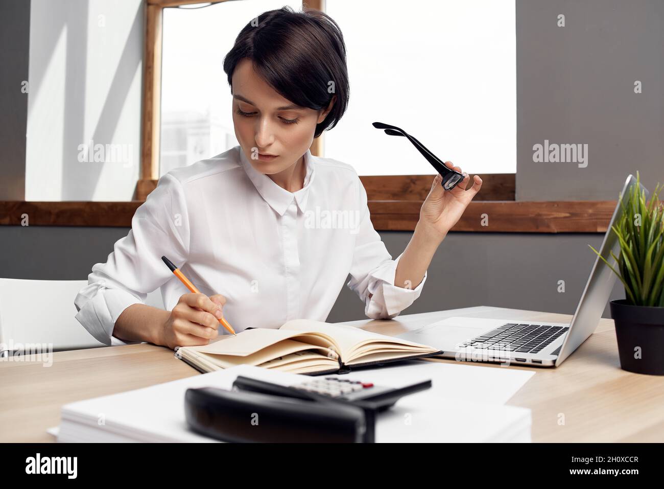 woman in costume in front of laptop Secretary executive light ...