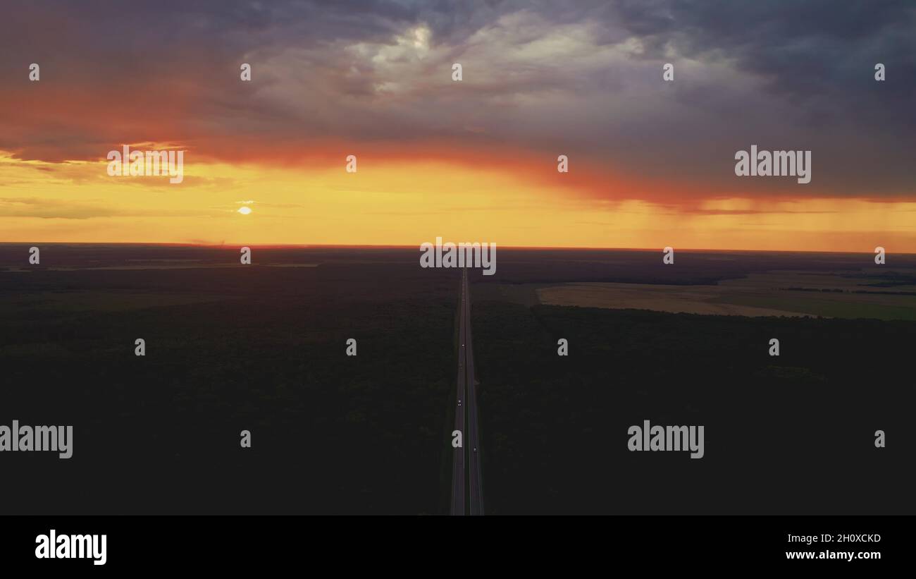 Aerial View Of Sunset Sky Above Highway Road Through Green Forest ...