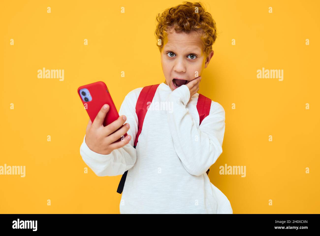 Funny male teen use the phone education kids lifestyle yellow ...