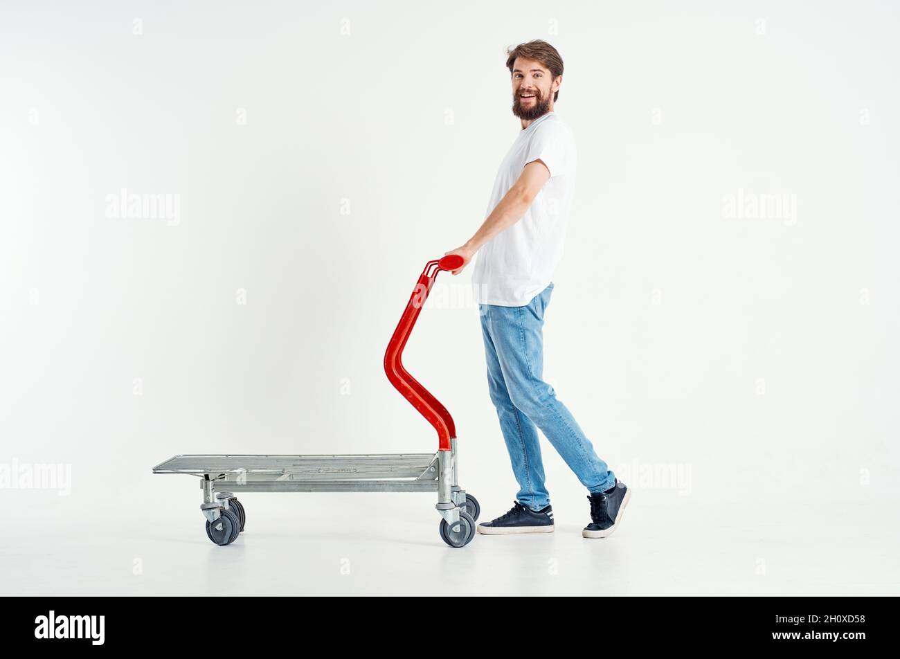 bearded man ride a cart entertainment shipping light background Stock ...