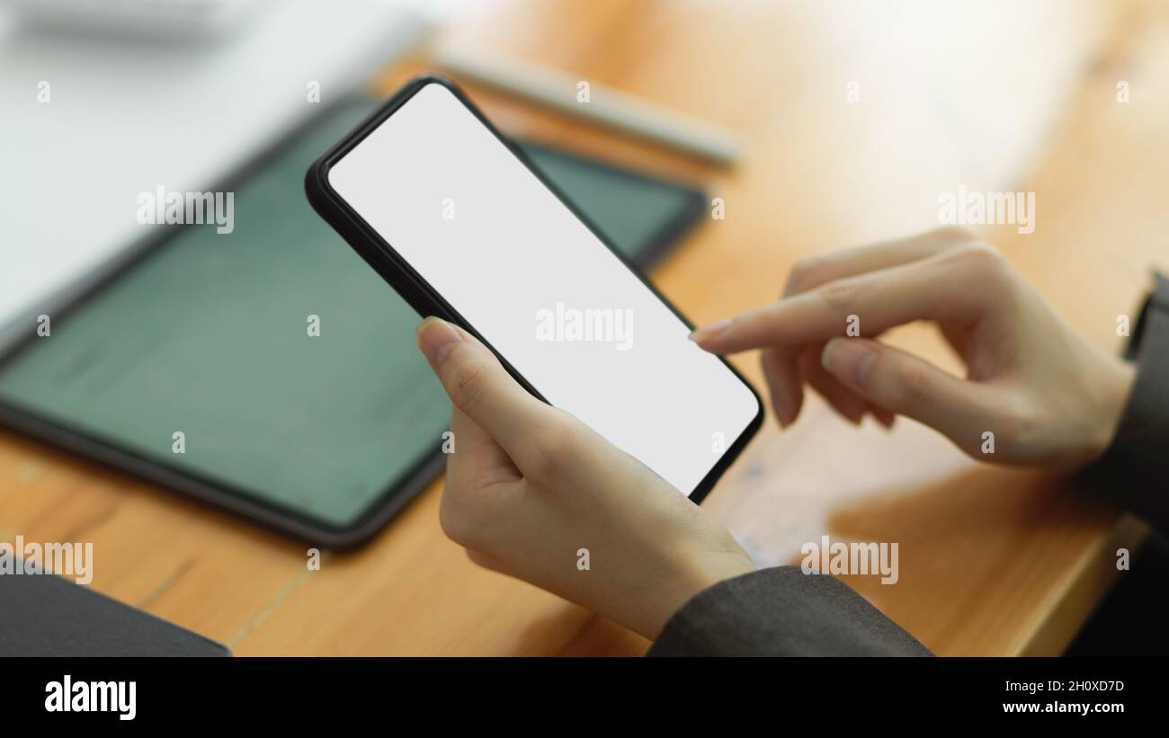 Close-up image of Female tapping finger on smartphone screen. mobile ...