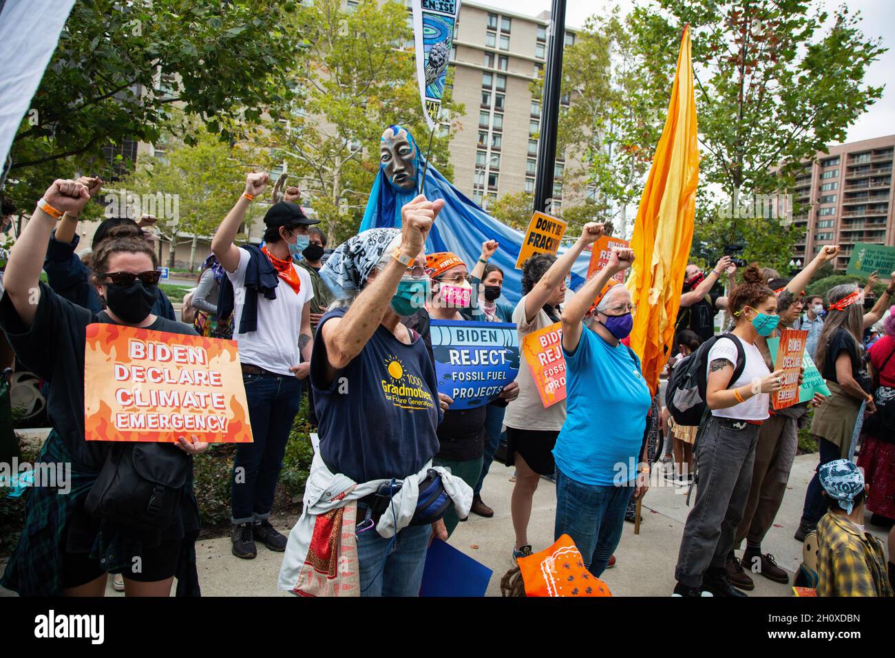 Arlington, United States. 13th Oct, 2021. Protesters hold placards ...