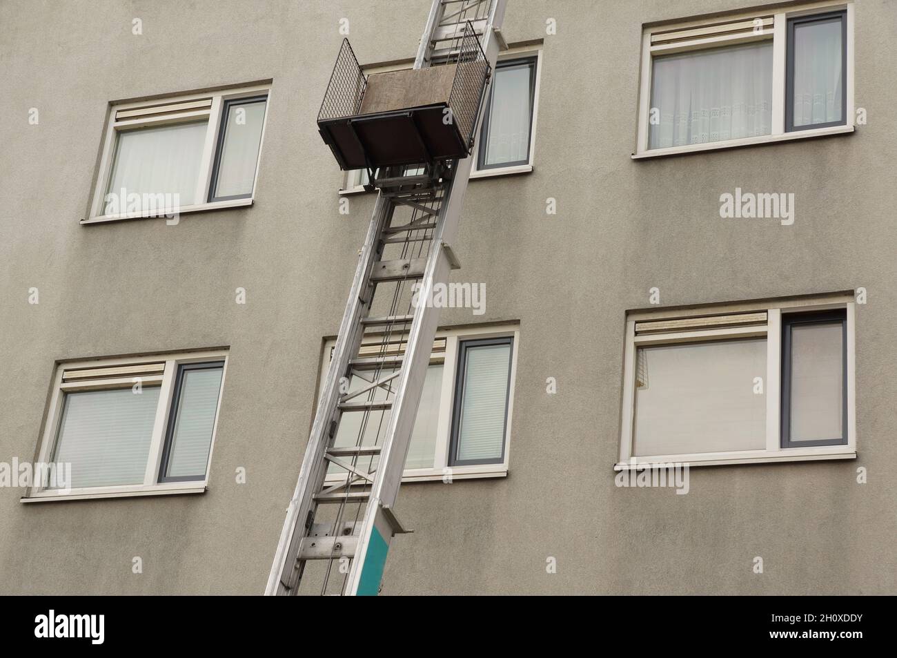 High ladder leaning against a building Stock Photo - Alamy