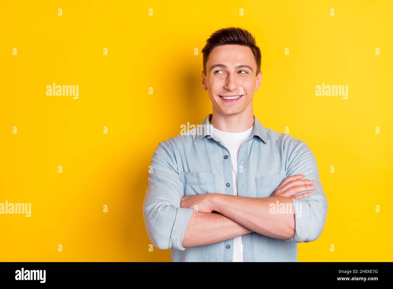 Portrait of attractive cheerful content guy folded arms copy blank ...
