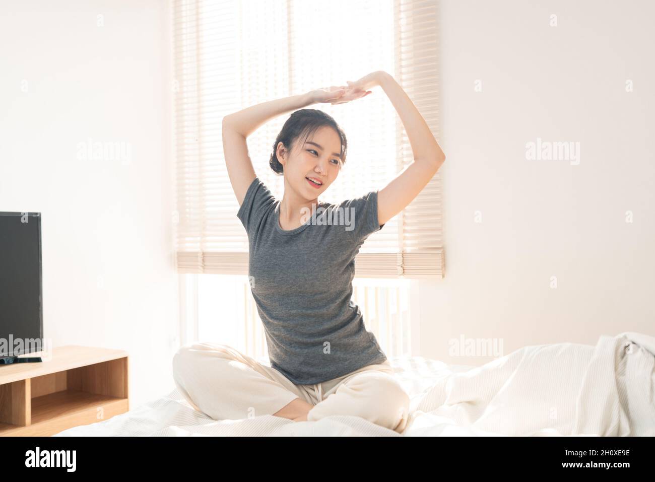 Bedroom concept in the morning the pretty girl just waking up and ...