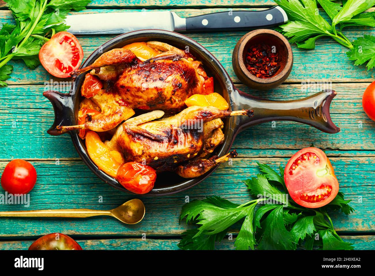 Whole quails baked in tomato sauce. Stewed quails Stock Photo - Alamy