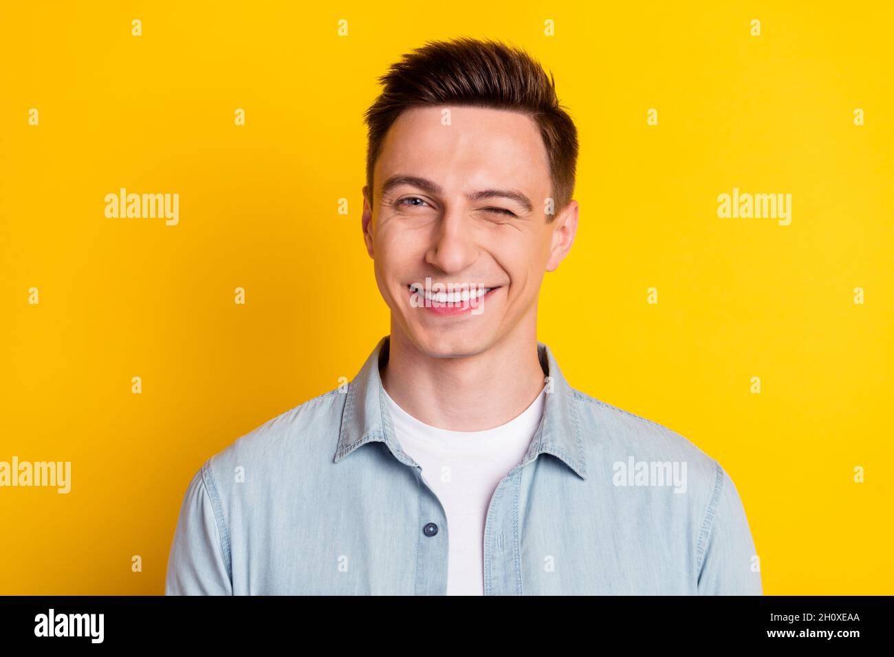 Portrait of young attractive handsome flirty man wink blink eye romance ...