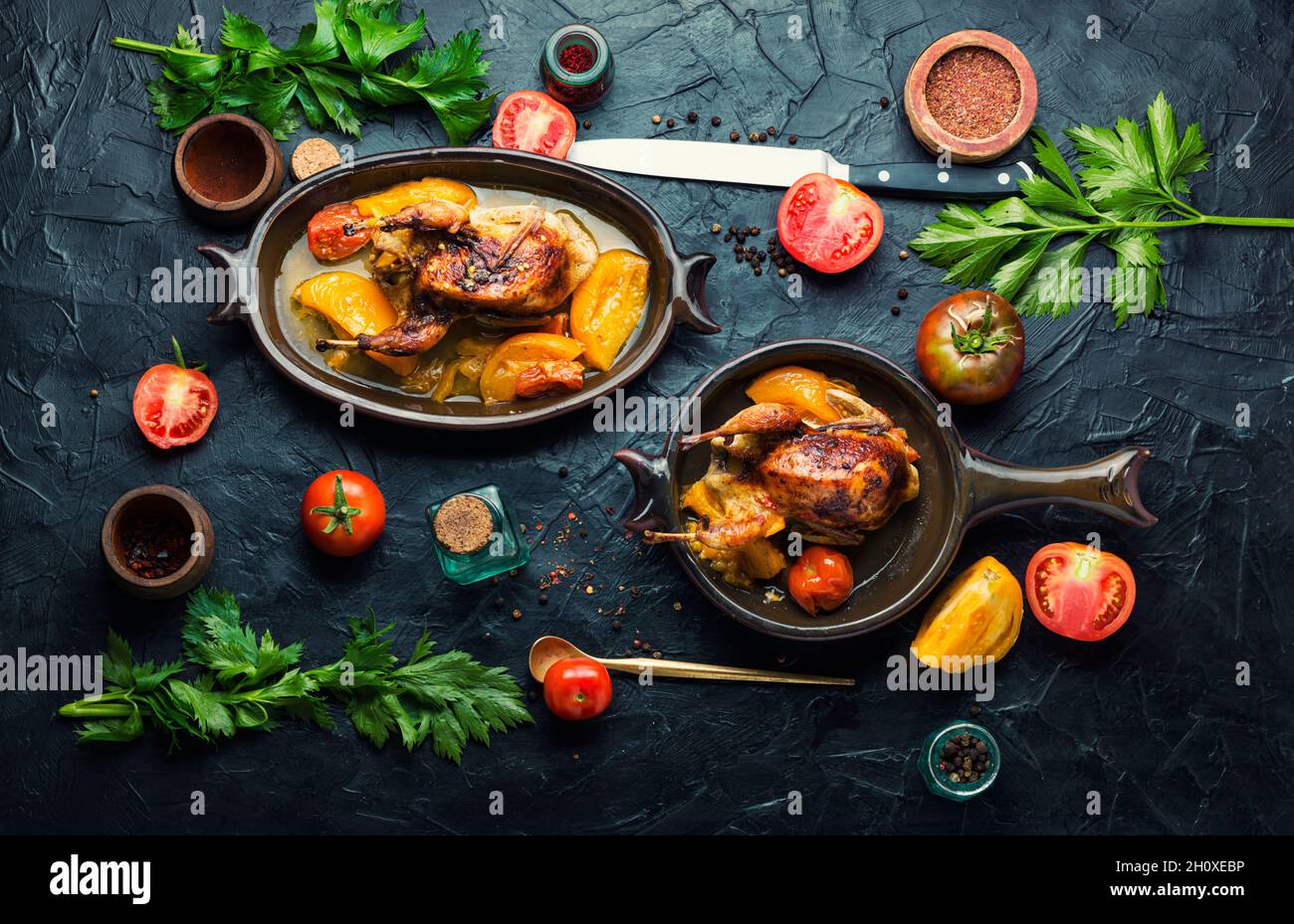 Whole quails roasted in tomato sauce. Fried quails meat Stock Photo - Alamy