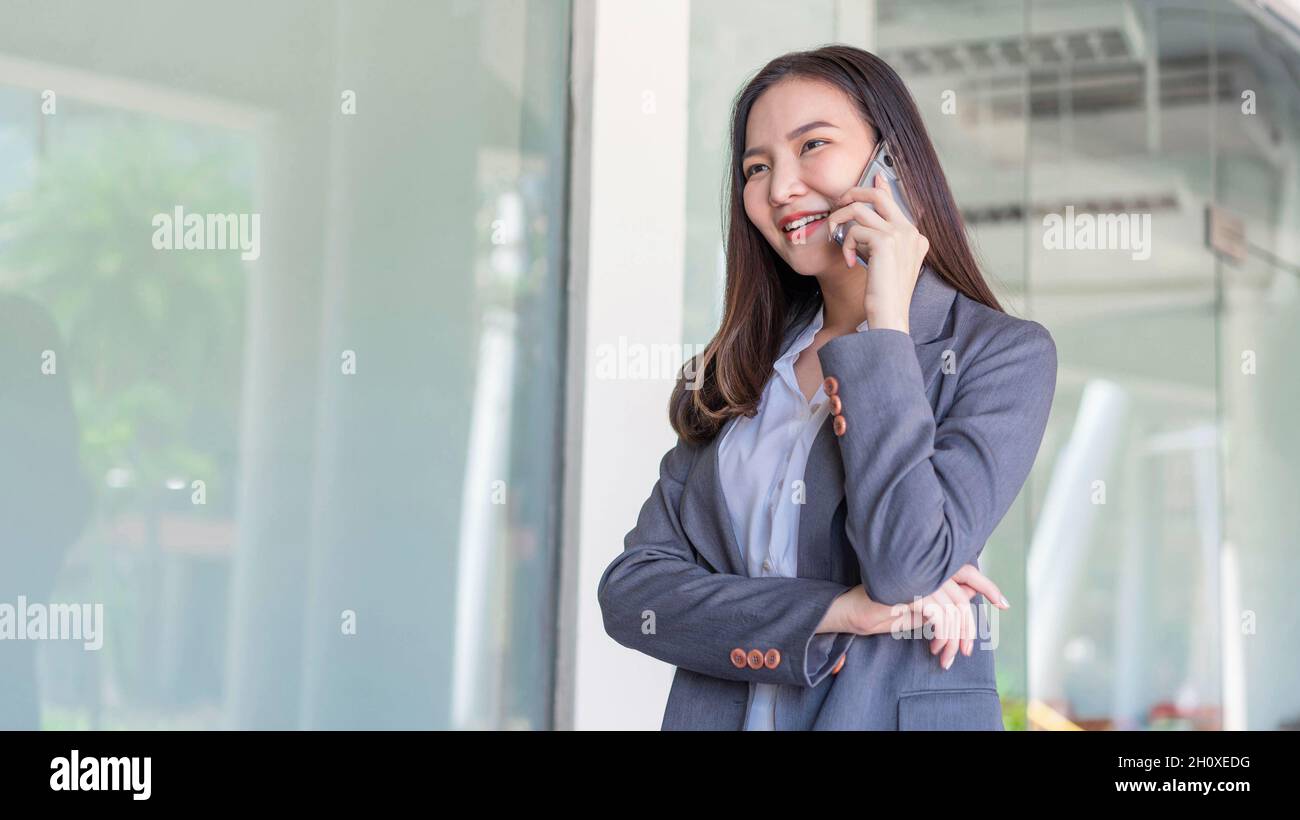 Working woman concept a working woman with smiley face speaking on the ...