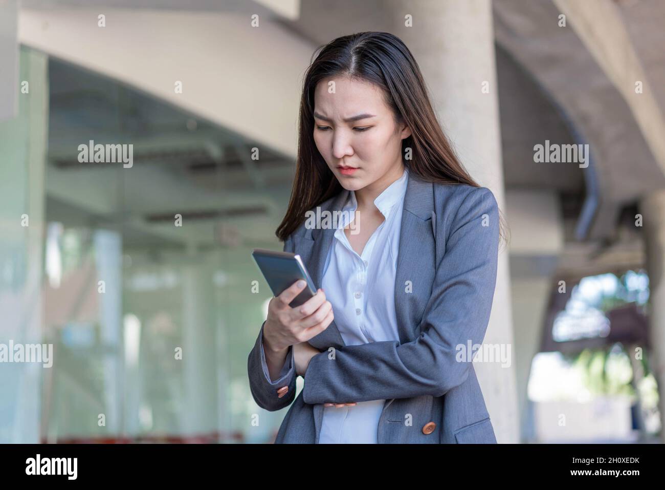 Working woman concept a young businesswoman fatigued after doing a load ...