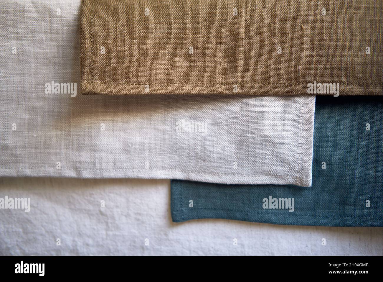 Scraps of natural flax of different colors. Grey, blue, white, brown ...