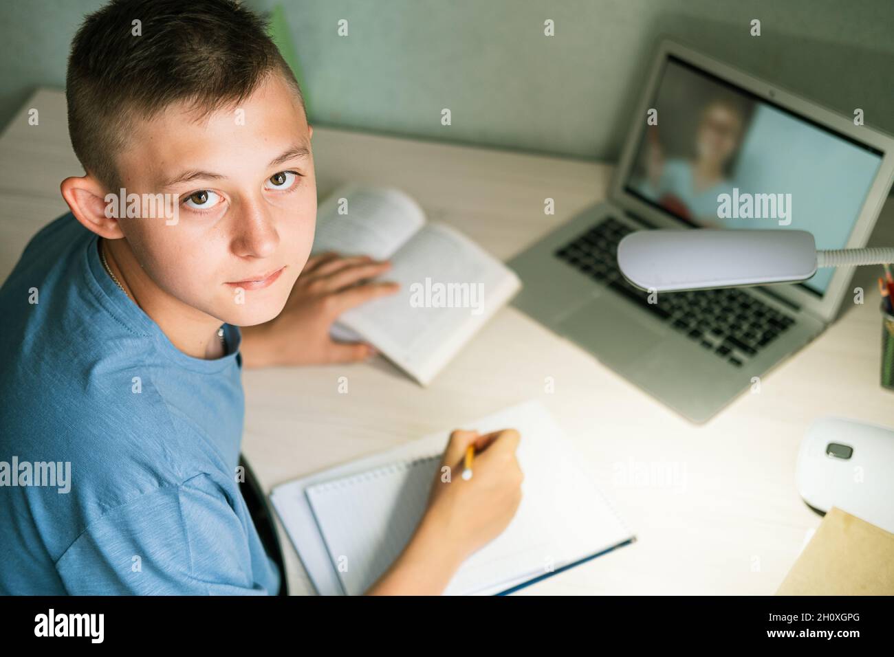 Laptop on the student's desk with the broadcast of the classroom Stock ...