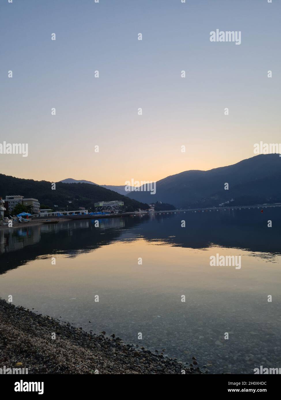 Scenic view of a calm coast with the reflection of the sky on the ...