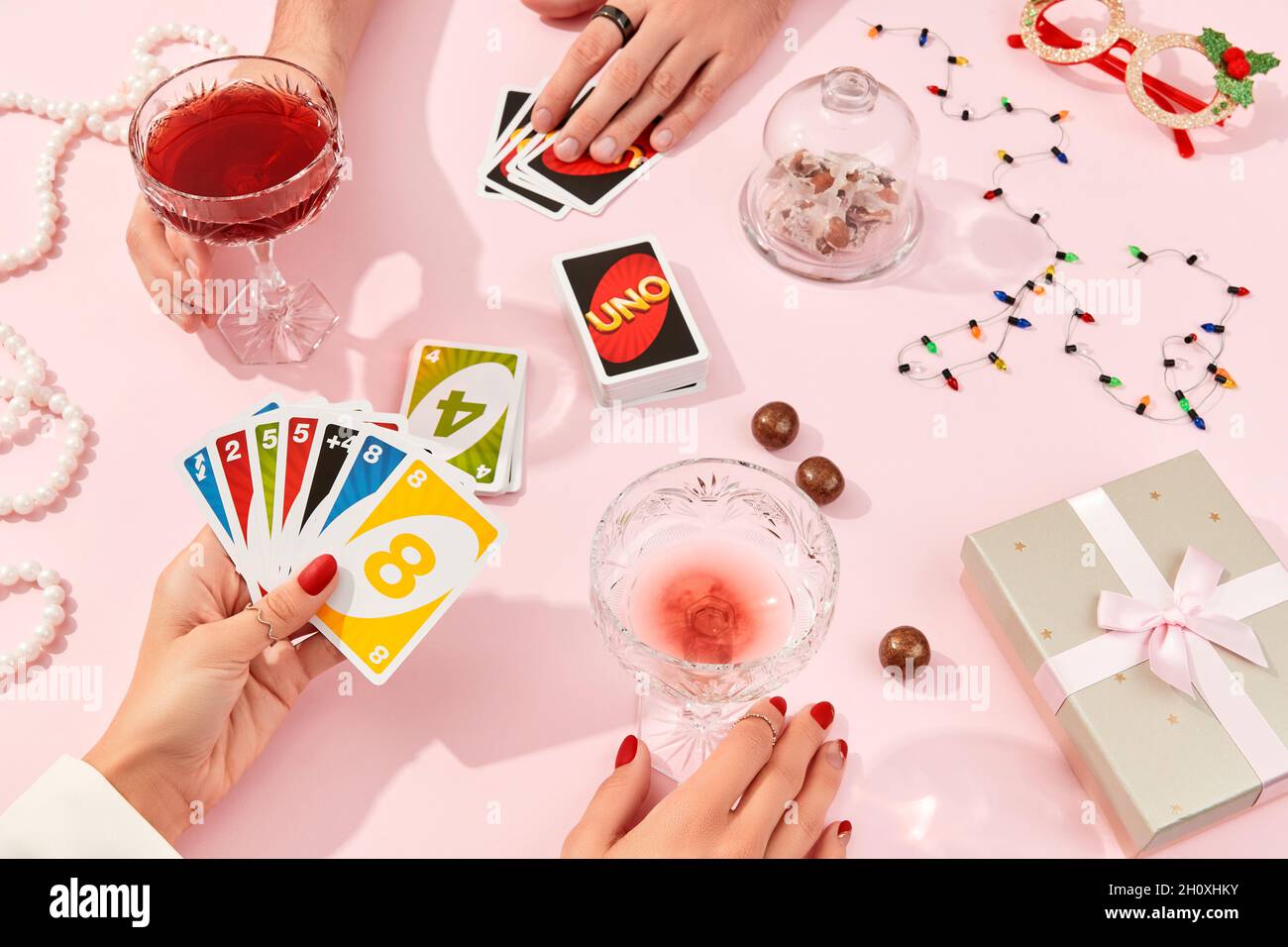 KIEV, UKRAINE - SEPTEMBER 10, 2021. Couple play uno game. Christmas ...