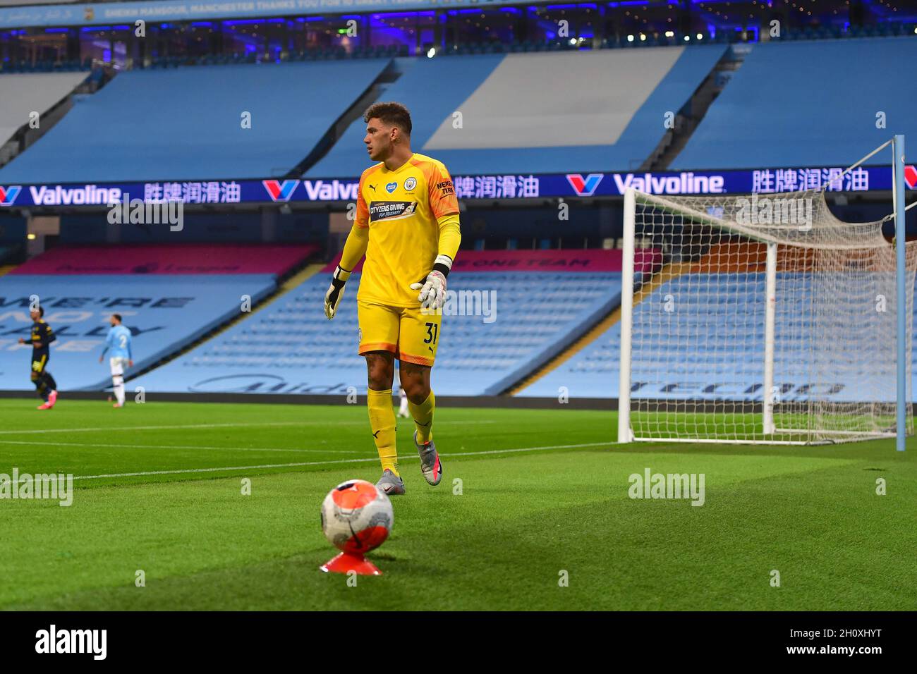 Manchester City goalkeeper Ederson collects a disinfected ball before ...