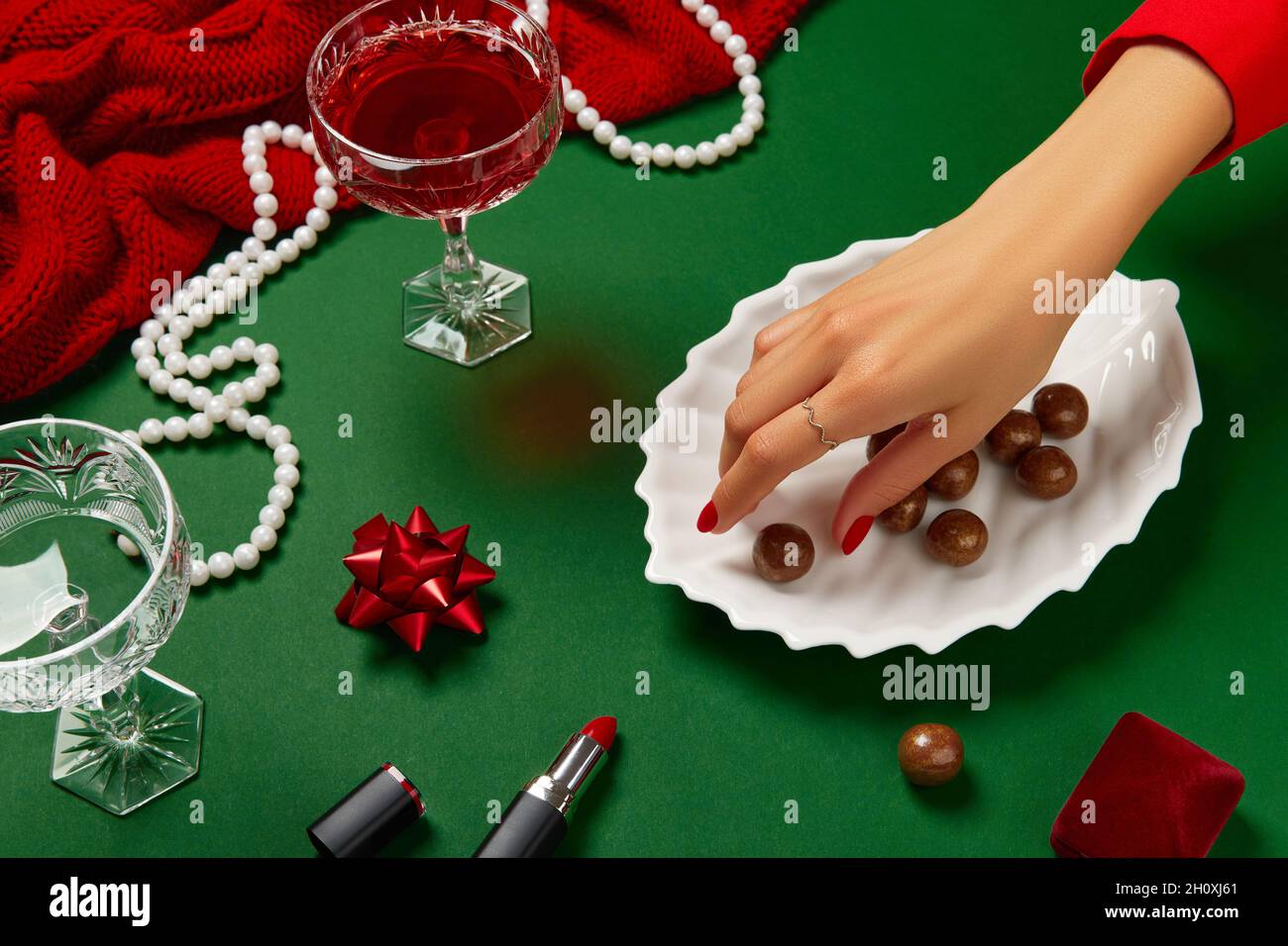 Christmas New Year creative composition with womans hands and glass of ...