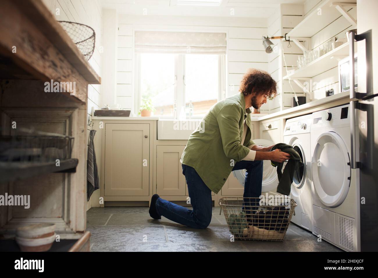 Loading washing machine hi-res stock photography and images - Alamy