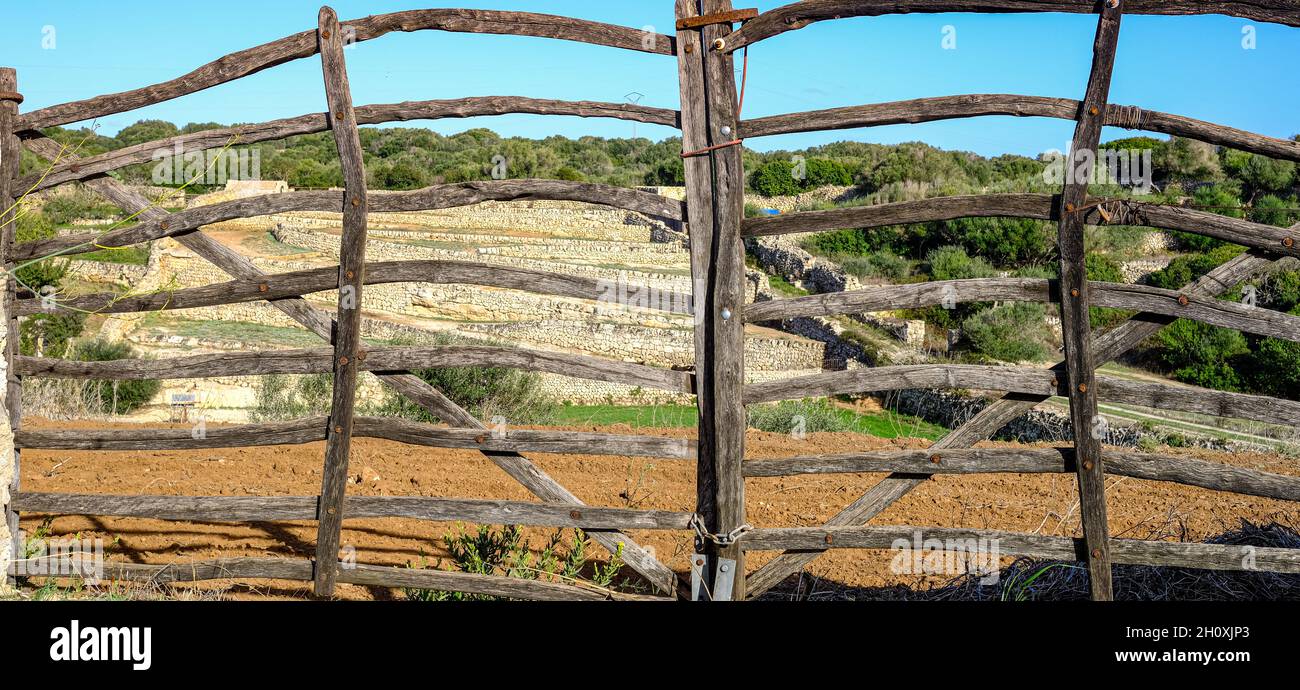 typical Minorcan gate made in wood with landscape behind. Menorca ...