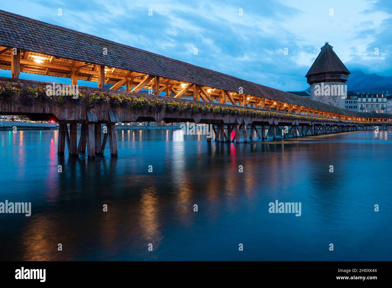 Kapellbrücke, medieval bridge in Luzern at night. The bridge is ...