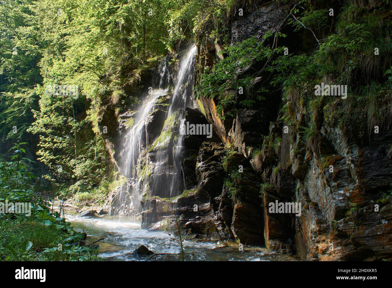 The waterfall on the river Jiet from Hunedoara, Romania in the green ...