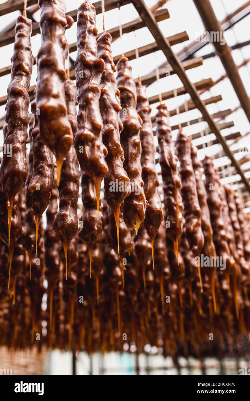 Homemade recipe and process of making churchkhela - Georgian candy made ...