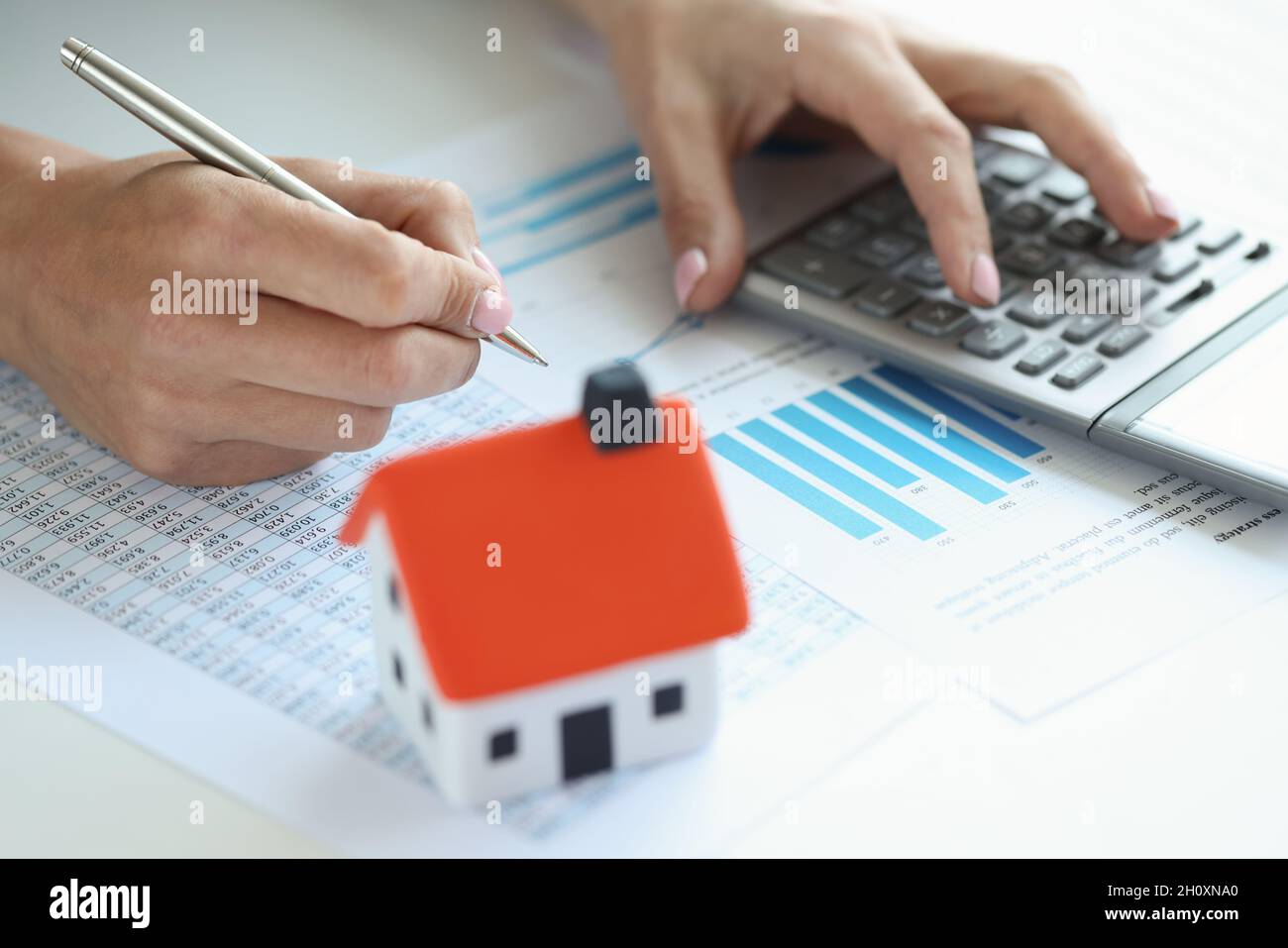 Buy house mortgage calculations calculator hi-res stock photography and ...