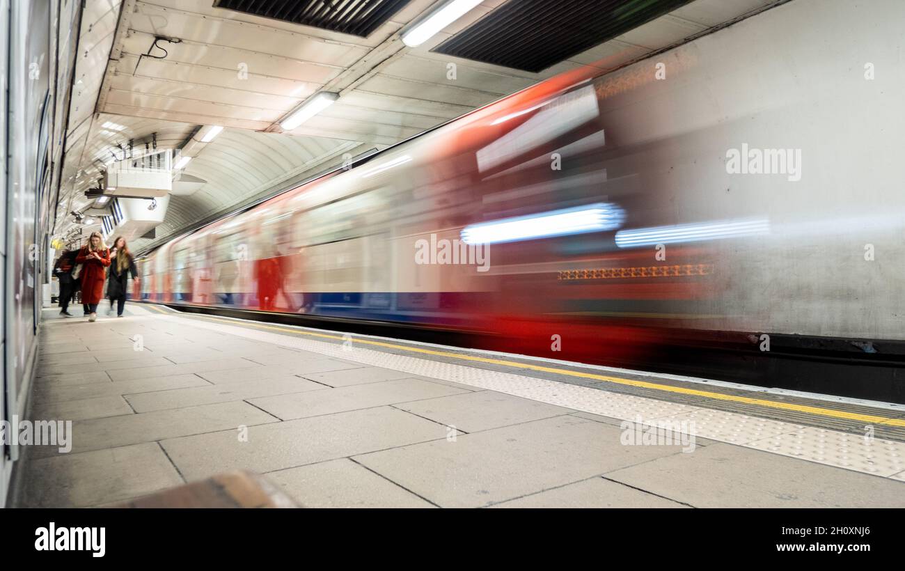 London Underground. Long exposure, wide angle blur of a tube train ...