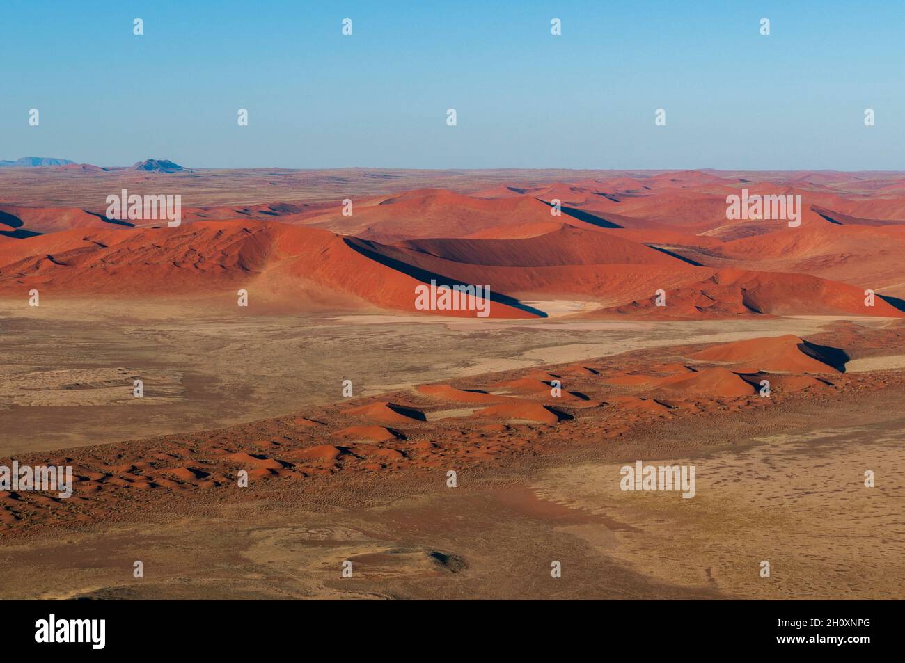An aerial view of red sand dunes in the Namib desert. Namib Naukluft ...