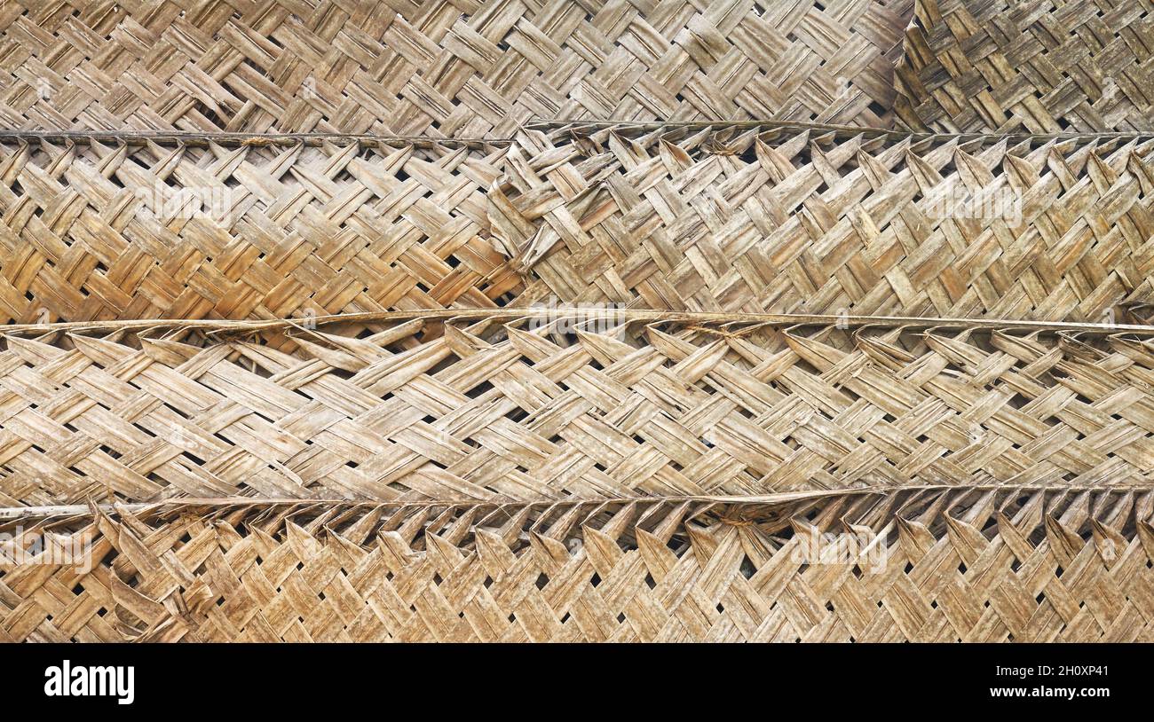 Dried palm leaf braid wall, natural background Stock Photo - Alamy