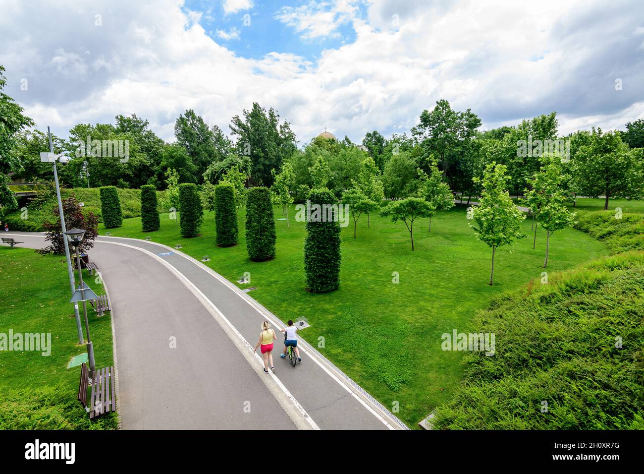 Bucharest, Romania - 29 May 2021: Landscape with alley and vivid green ...
