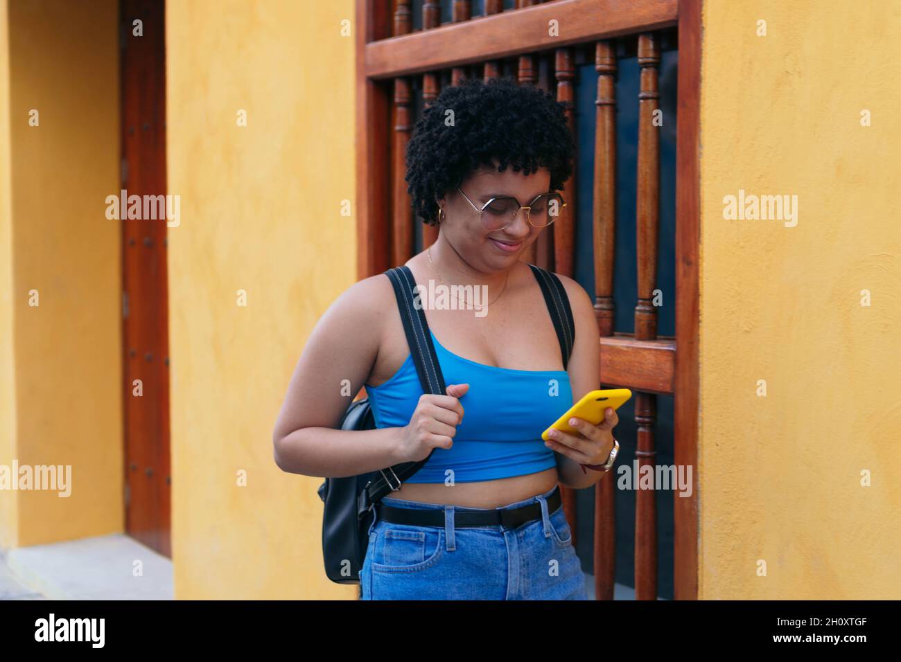 Side View Of A Young Afro Woman Smiling Stock Photo - Alamy